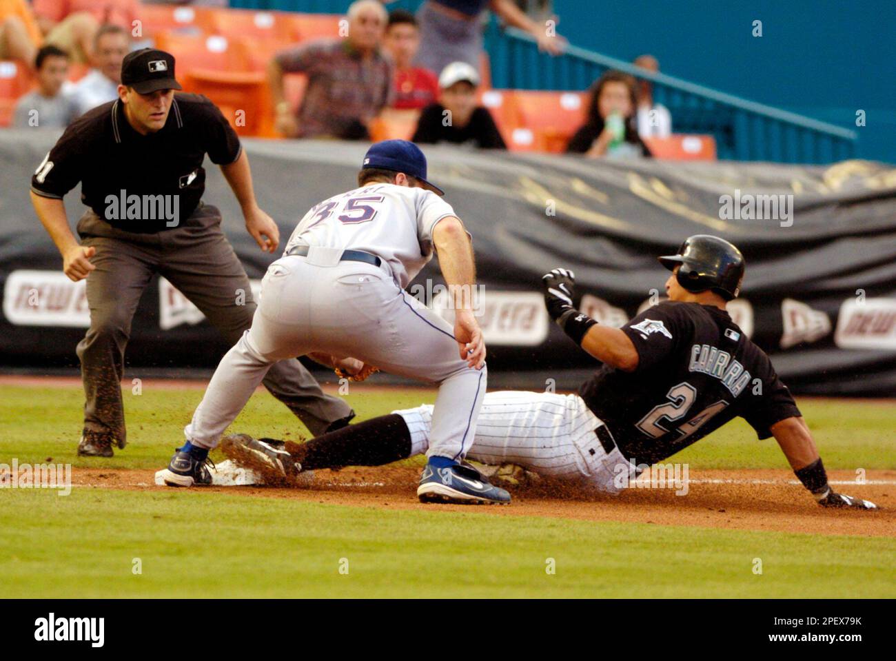 Florida Marlins' Miguel Cabrera slides safely into third base after ...