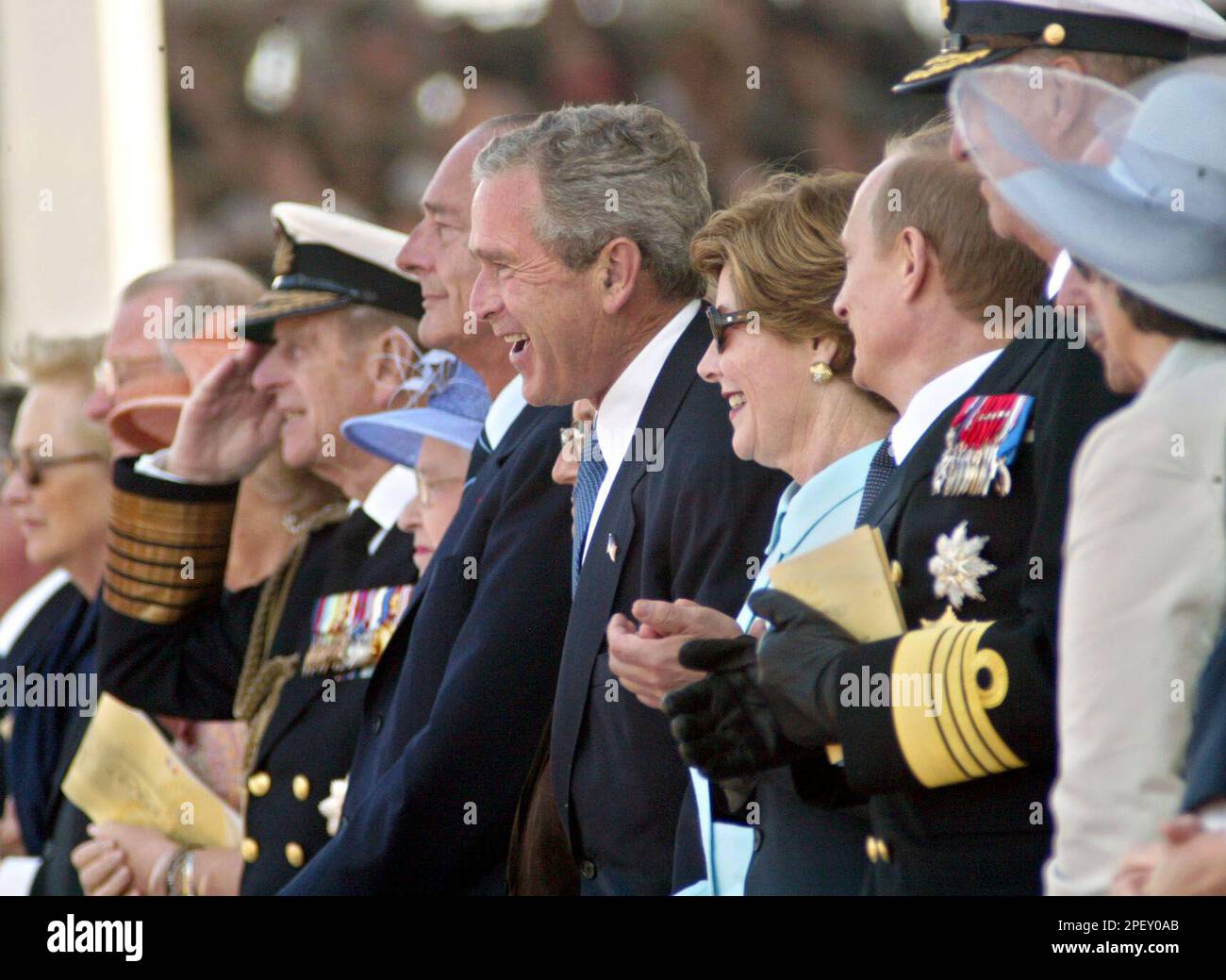 U.S. President George W. Bush, center, shares a laugh with his wife, U ...