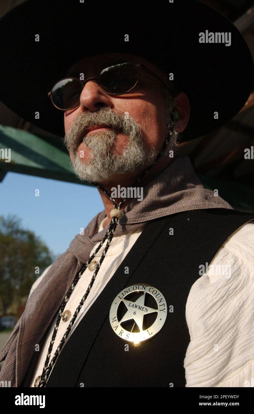 Steven Pass, aka Joe Pete, wears his Lincoln County Lawmen badge during ...