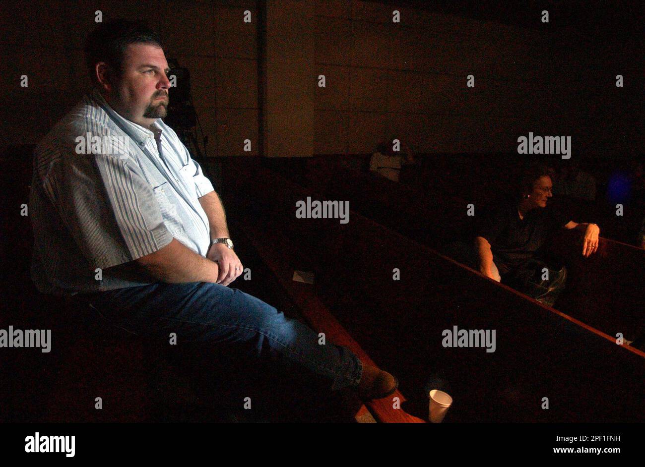 David Loman, brother of Jennifer Blagg, sits in the darkened Mesa ...