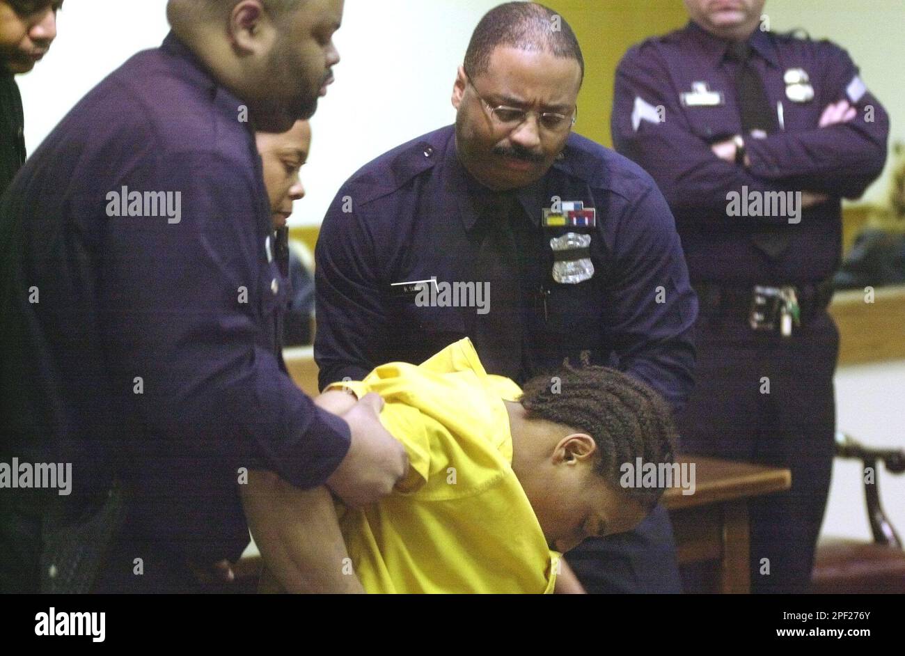 Eric Marshall collapses during his arraignment in Detroit, Tuesday, Feb ...