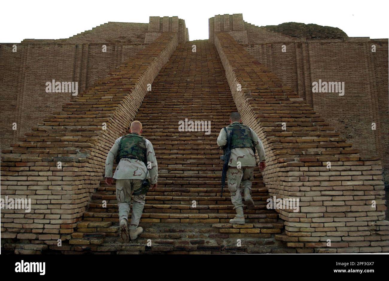 US Army soldiers climb the 4,000-year-old ziggurat, a terraced mud ...