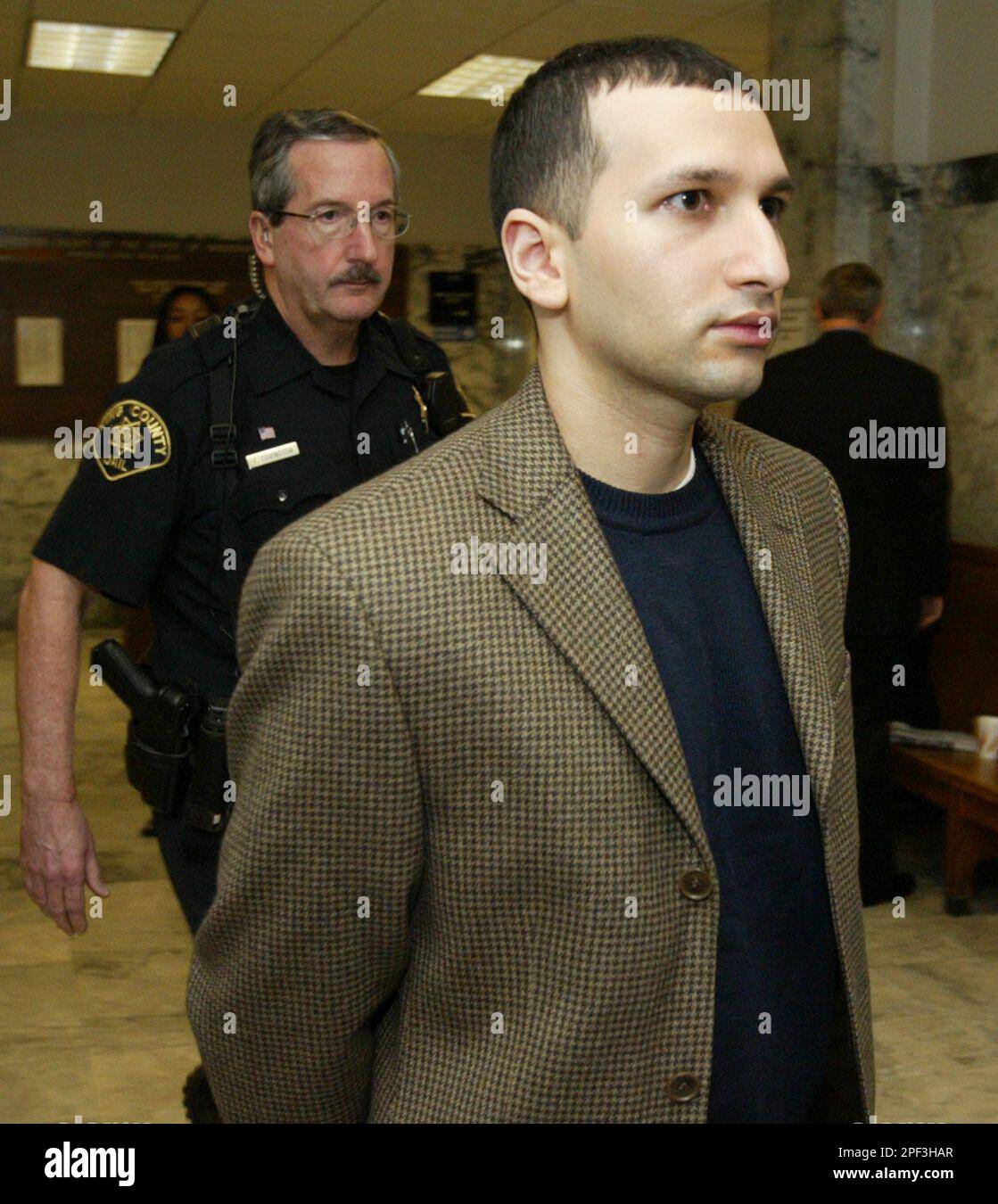 Atif Rafay is led from court during a break in his trial along with co ...