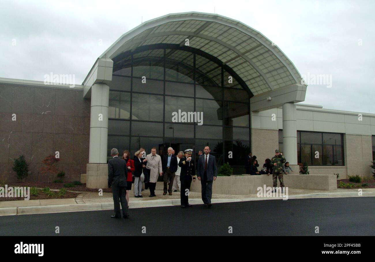 Visitors leave the new Charles C. Carson Center for Mortuary Affairs at ...