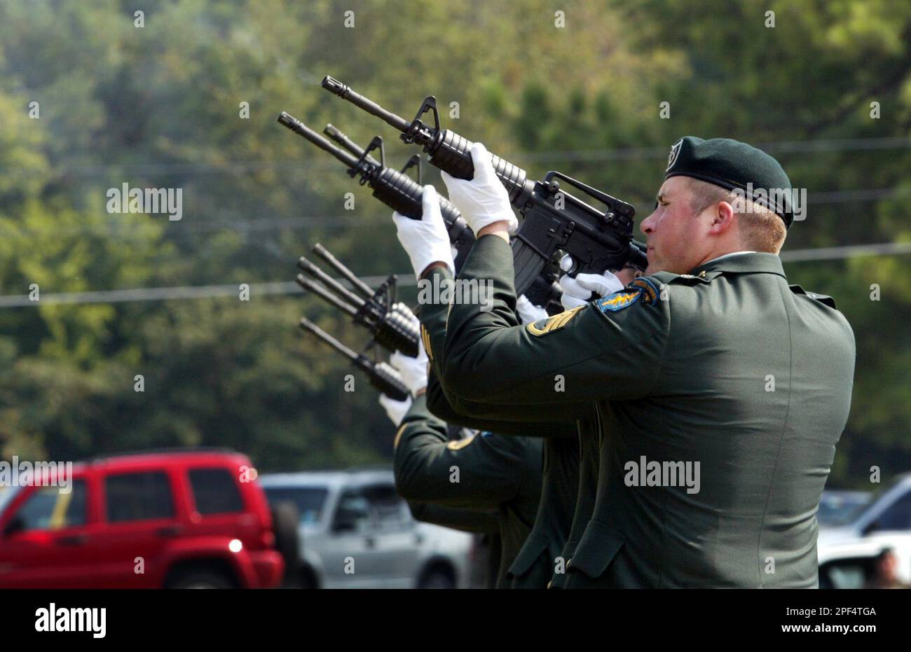 Fifth Special Force Group members fire their rifles as smoke streams ...