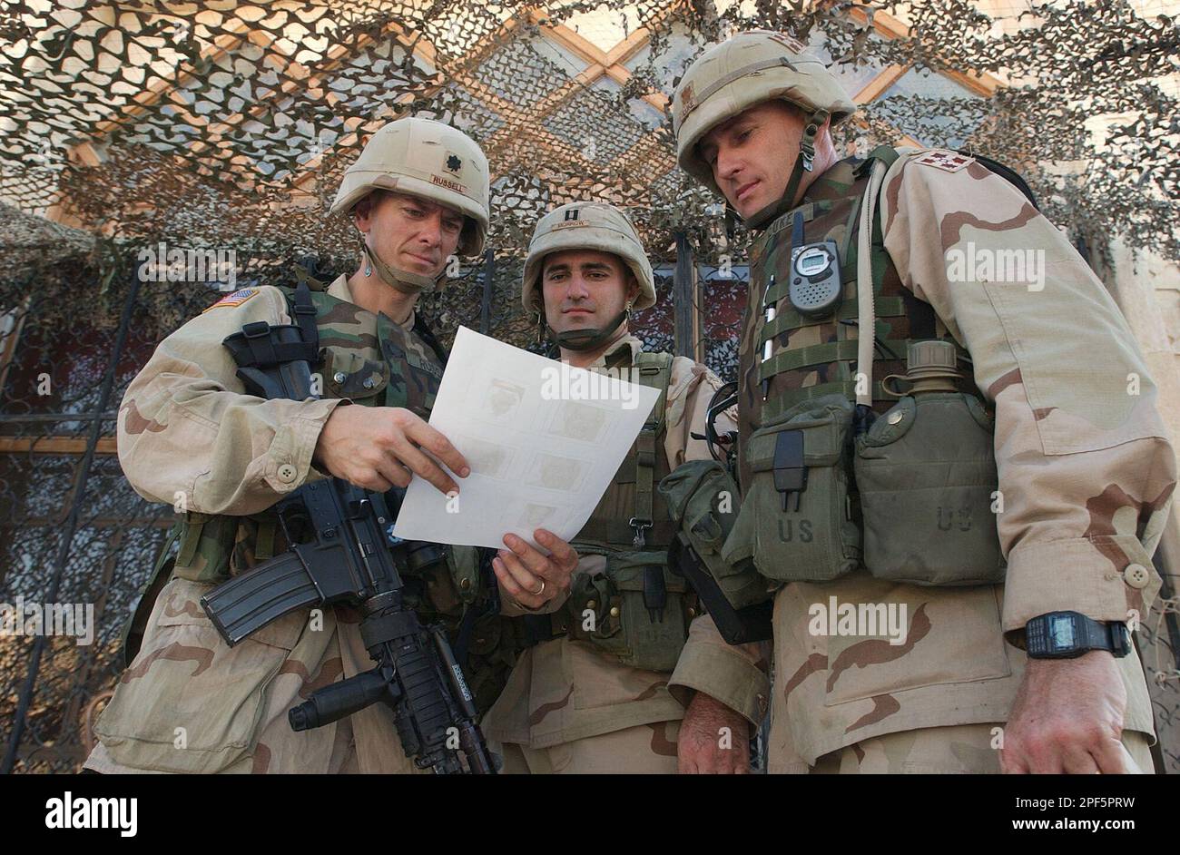 U.S. Army Lt. Col. Steve Russell, left, Cat. Timothy Morrow, center and ...