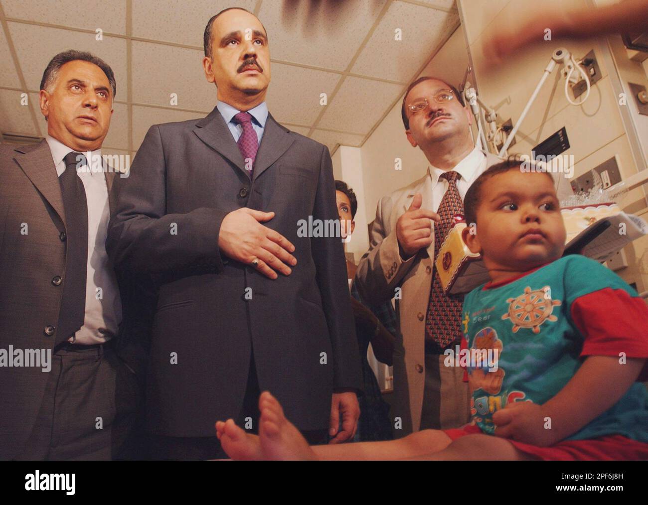 Sharif (Prince) Ali Bin al-Hussein (2nd from left) is briefed by a ...