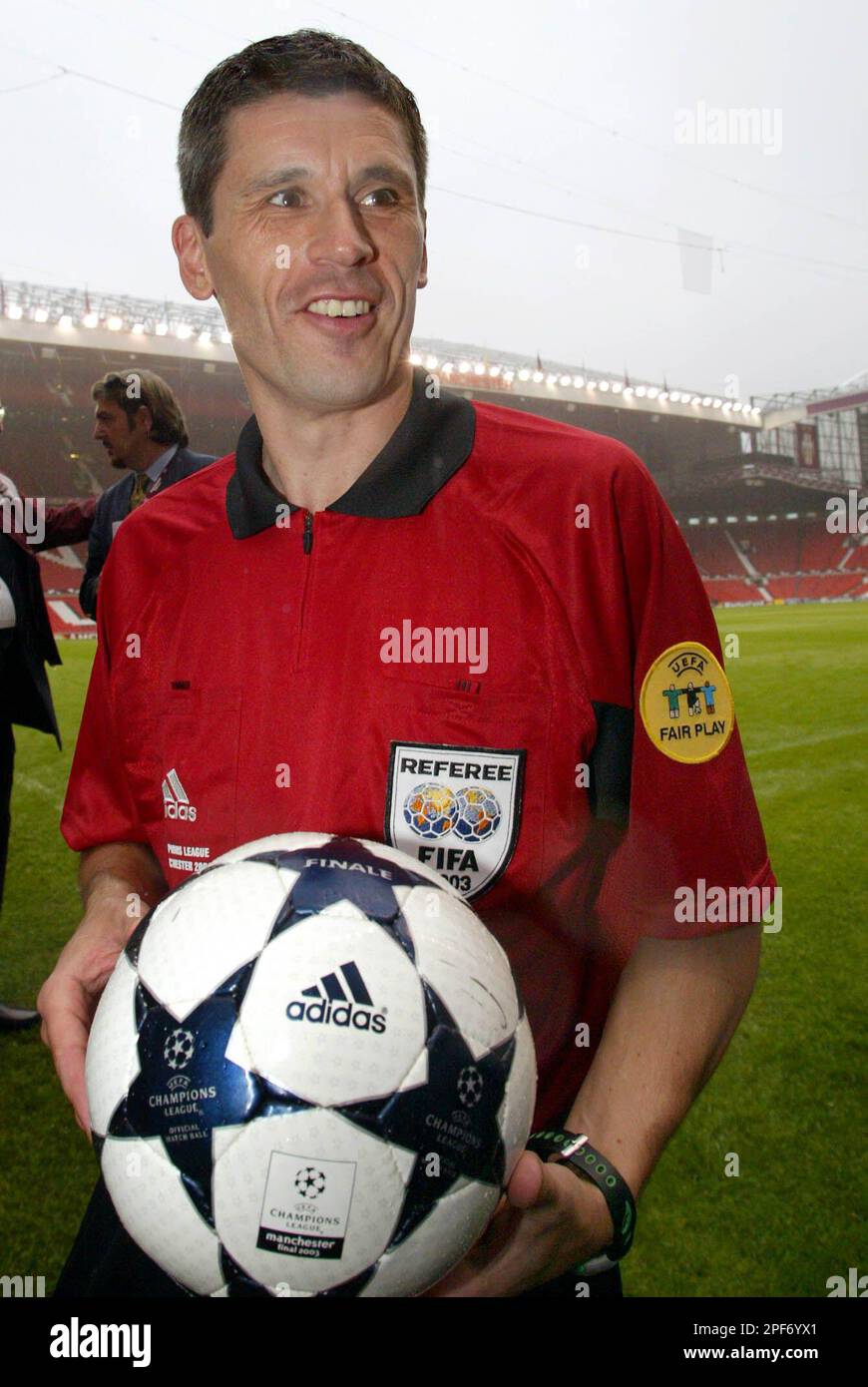 German referee Markus Merk smiles as he leave the pitch at Manchester ...