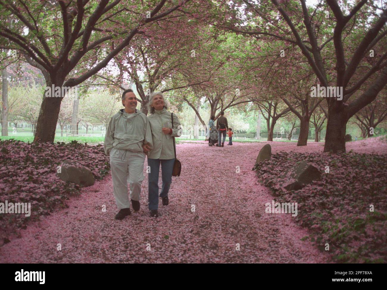 Alice Yaker and her husband, Jerry Goldfeder, of Manhattan, walk on a ...