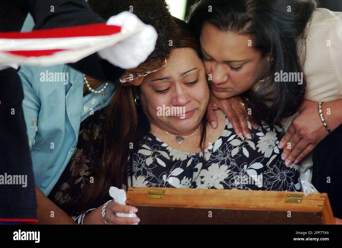Cherice Johnson, center, widow of Navy medic Michael Vann Johnson Jr ...