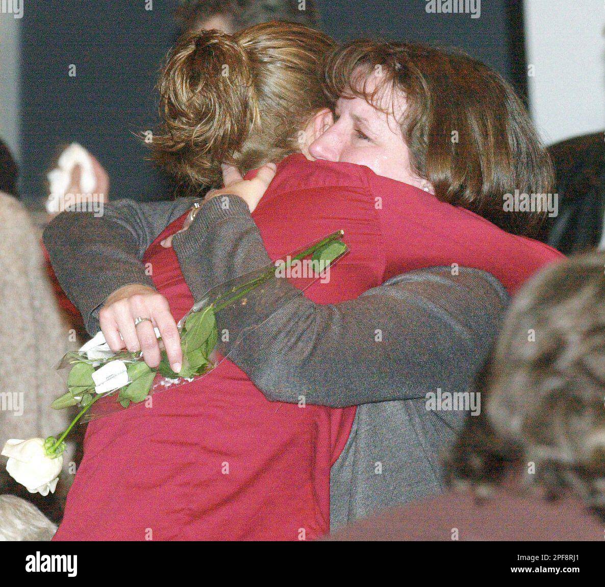 Debbie Endsley, right, sister of murder victim Amy Warner, receives a ...