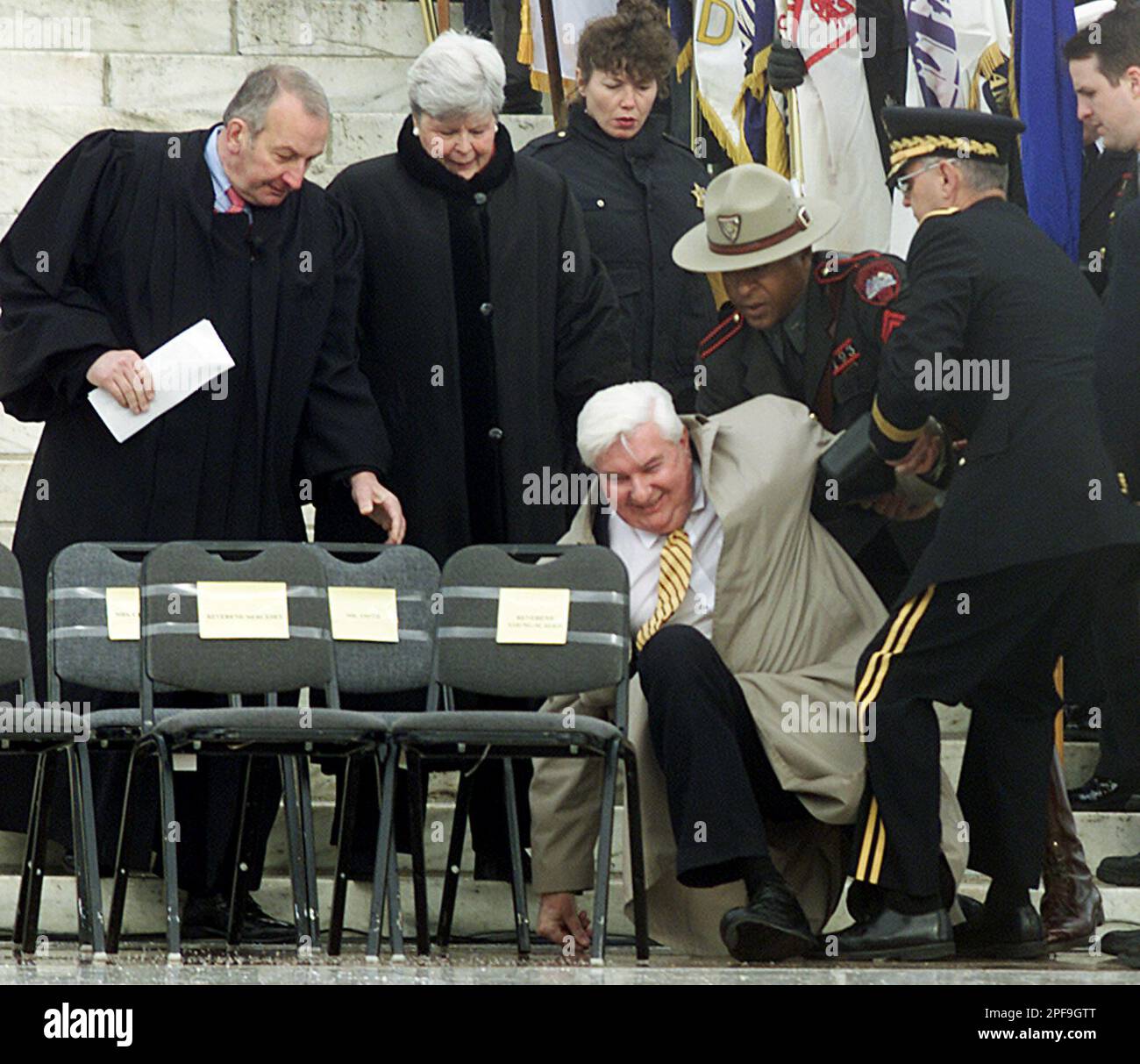 Rhode Island Gov. Lincoln Almond, below right, receives help from a R.I ...