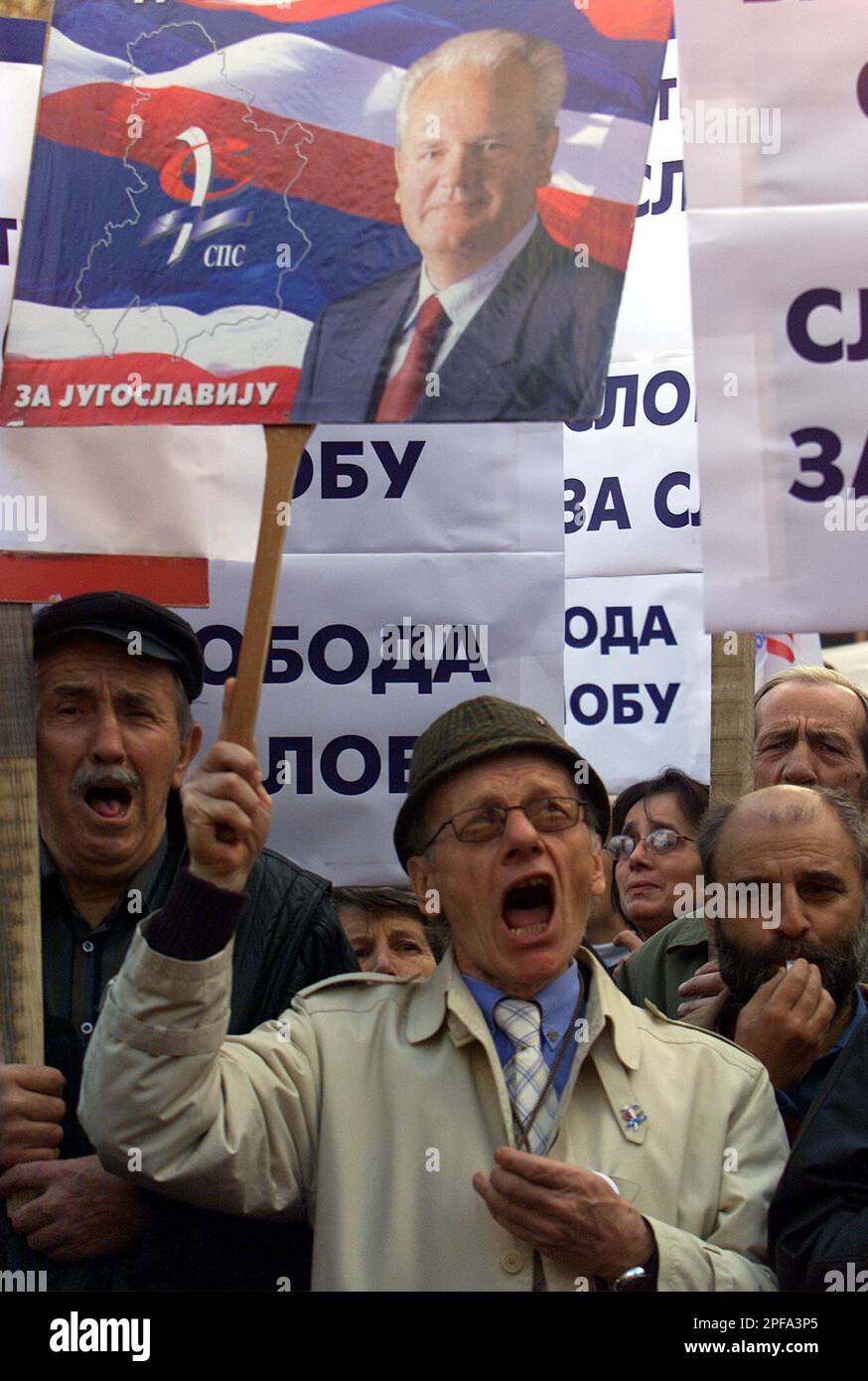 Die-hard supporters of ousted Yugoslav President Slobodan Milosevic ...