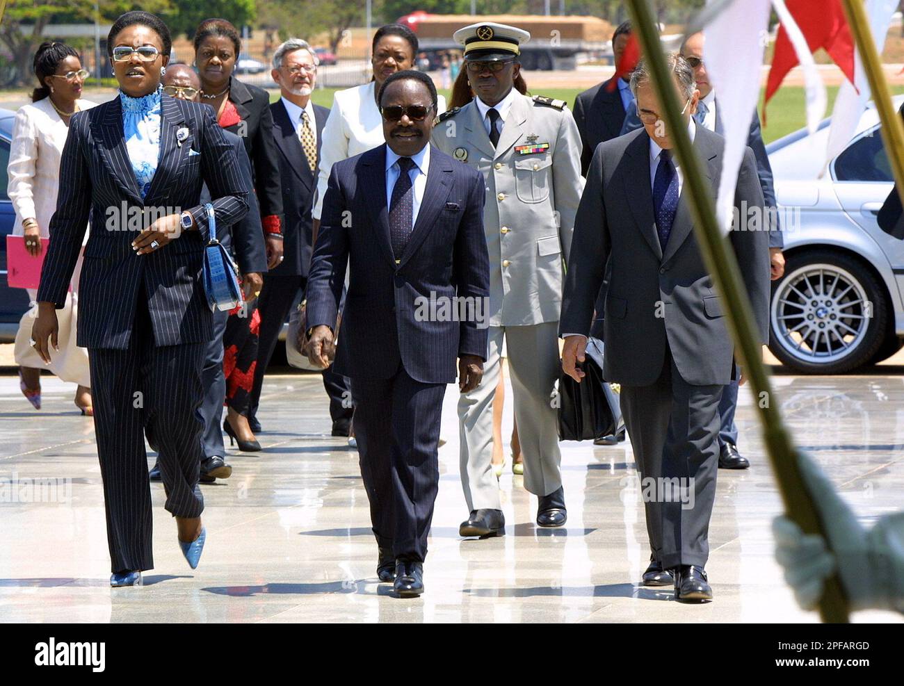 President of Gabon Omar Bongo, center, accompanied by first lady Edith Lucie Bongo, left ...