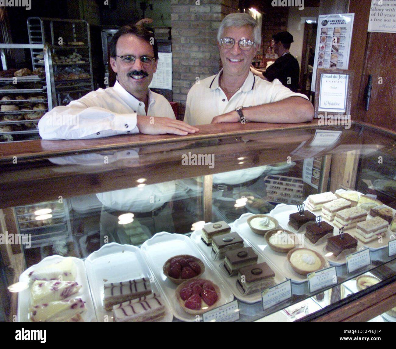 La Madeleine Chief Executive Officer John Corcoran, left and marketing ...
