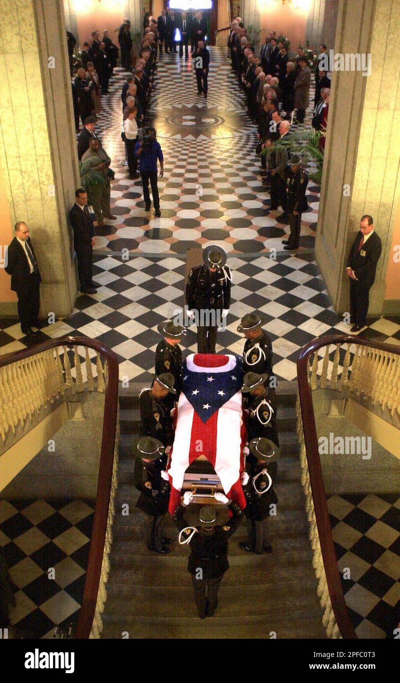 Ohio State Troopers carry the flag-draped casket of former Ohio Gov ...