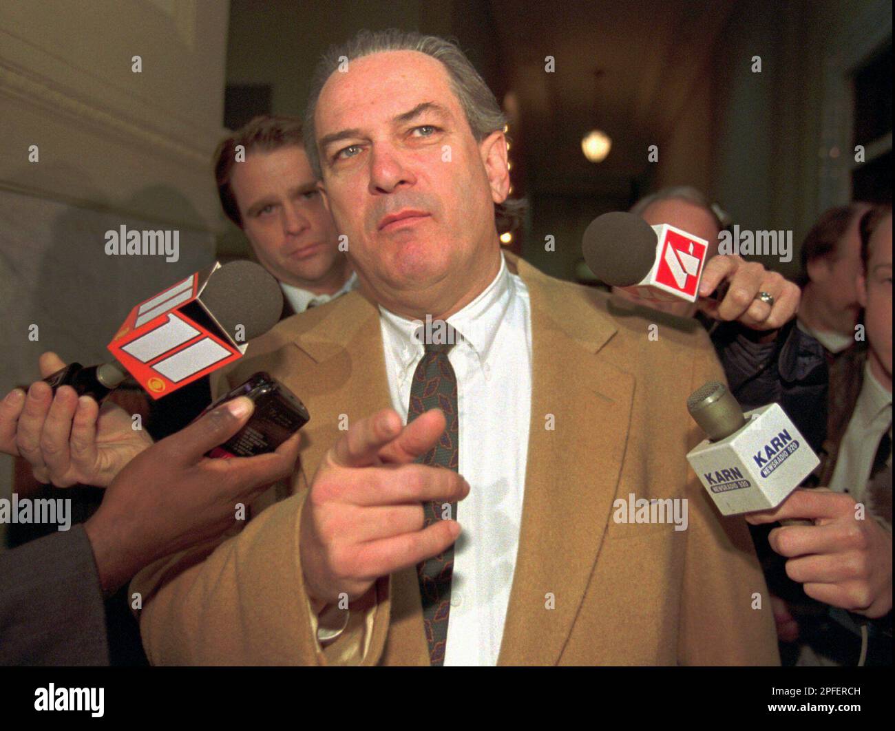 Former Arkansas Secretary of State, Bill McCuen, is surrounded by ...