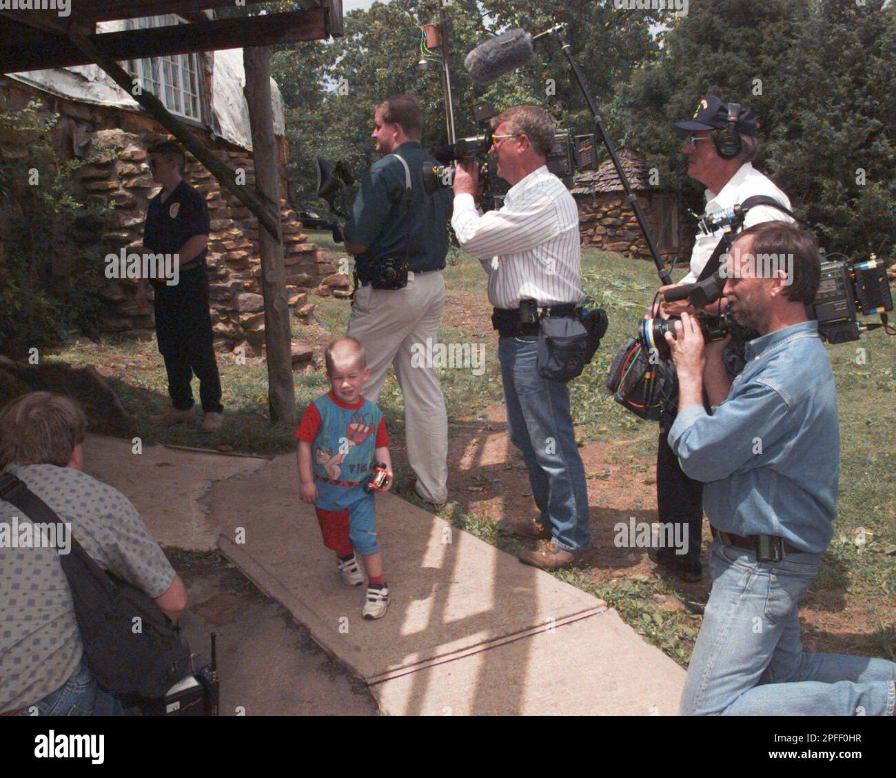 Michael Millar walks past photogrpahers Wednesday, May 24, 1995, at the ...