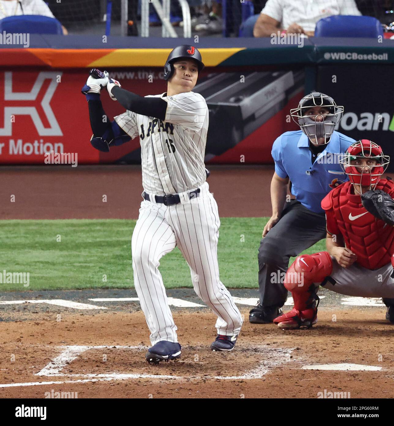 Shohei Ohtani makes a base hit in the 6th inning during the World Baseball Classic (WBC ...