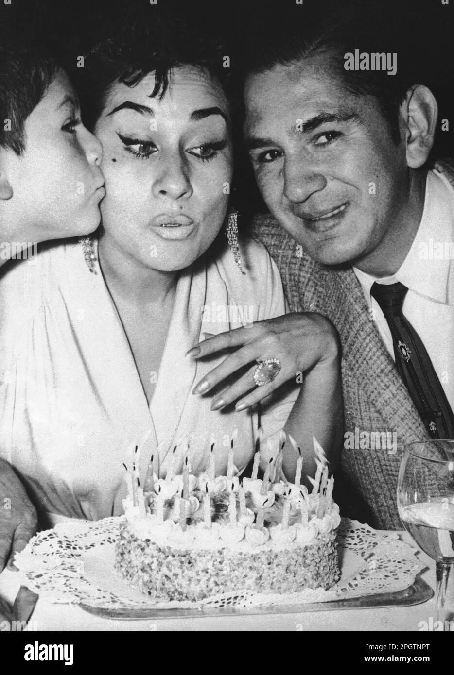 Peruvian singer Yma Sumac, center, is flanked by her son, Charles, left ...