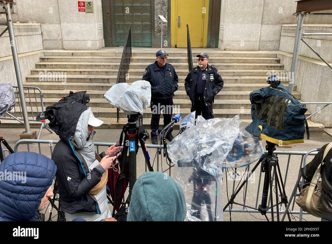 News media members wait outside the Louis J. Lefkowitz State Office ...