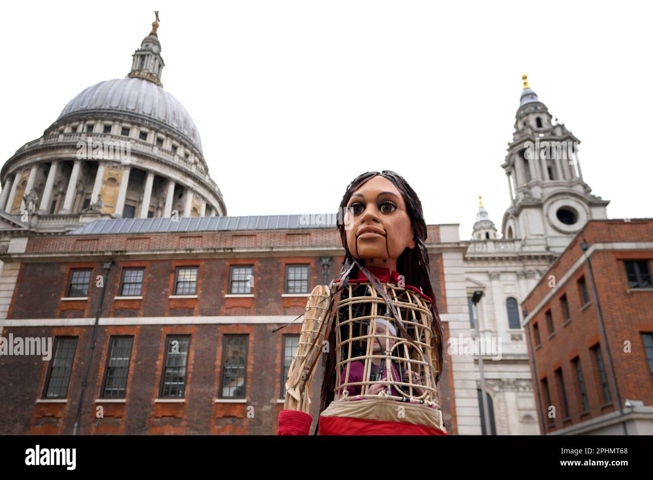 The puppet called Little Amal performs in Paternoster Square in London ...