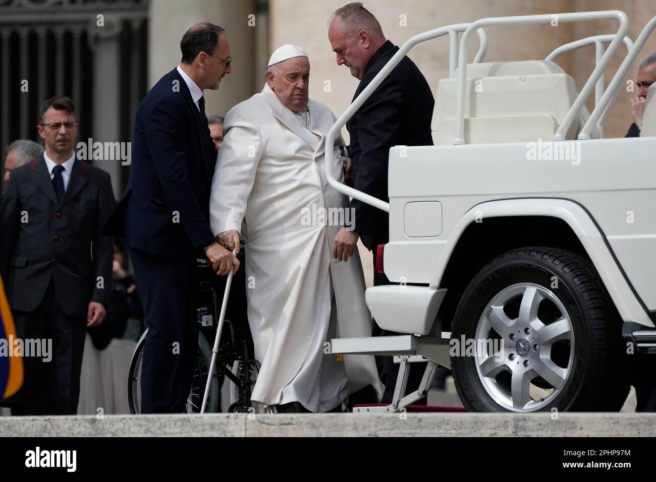 Pope Francis helped to get on his car at the end of weekly general ...