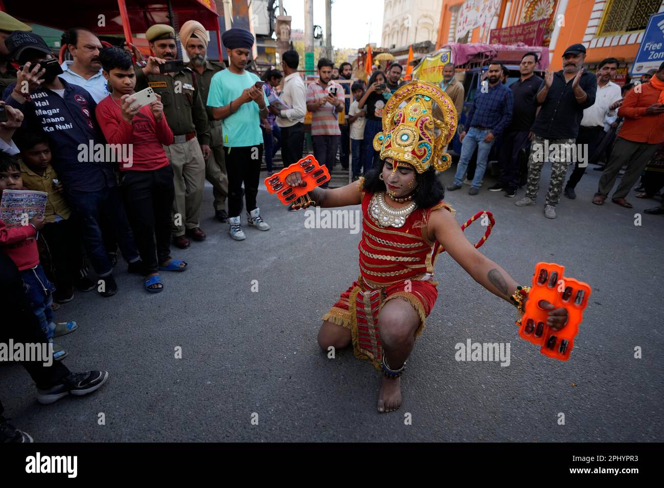 A hindu devotee dressed as monkey god Hanuman participates in a ...