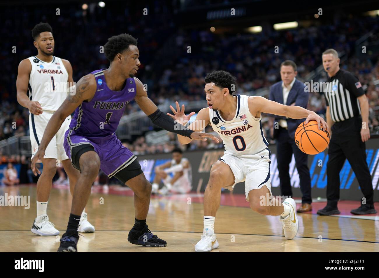 Virginia guard Kihei Clark (0) is defended by Furman guard JP Pegues (1 ...