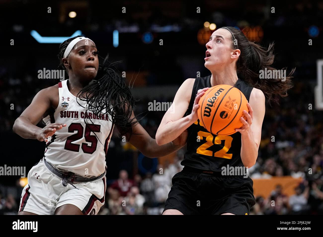 Iowa's Caitlin Clark looks to shoot past South Carolina's Raven Johnson ...