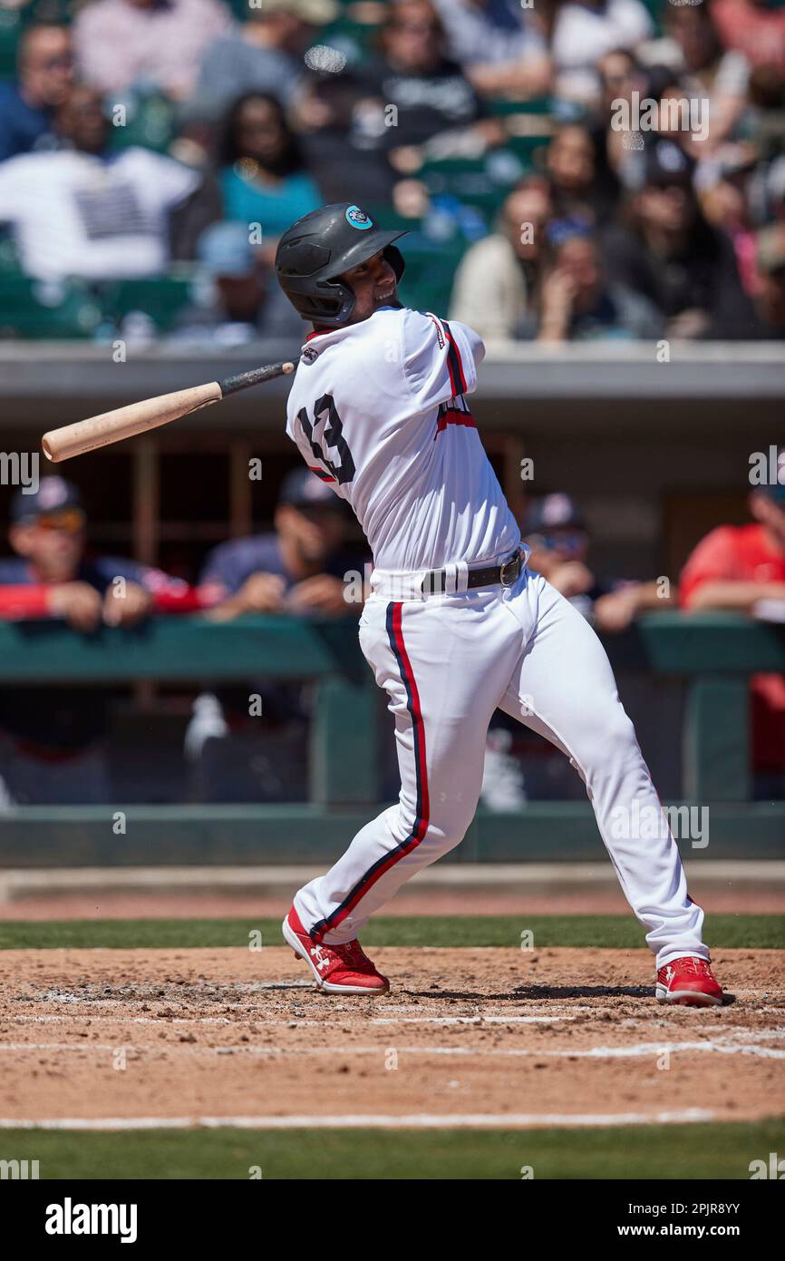 Lenyn Sosa (13) of the Charlotte Knights follows through on his swing ...