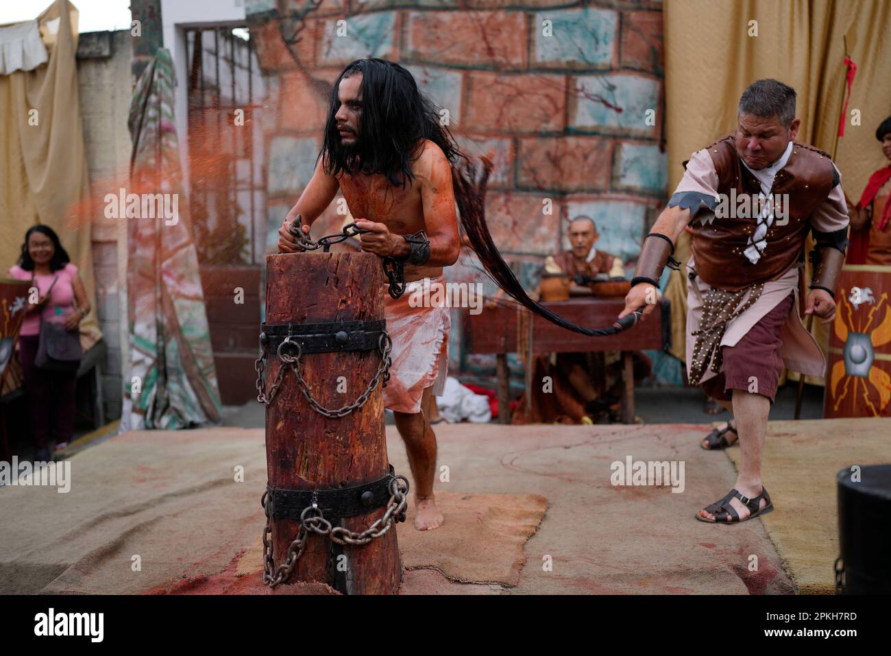 A penitent depicting the role of Jesus Christ is whipped by a fellow ...