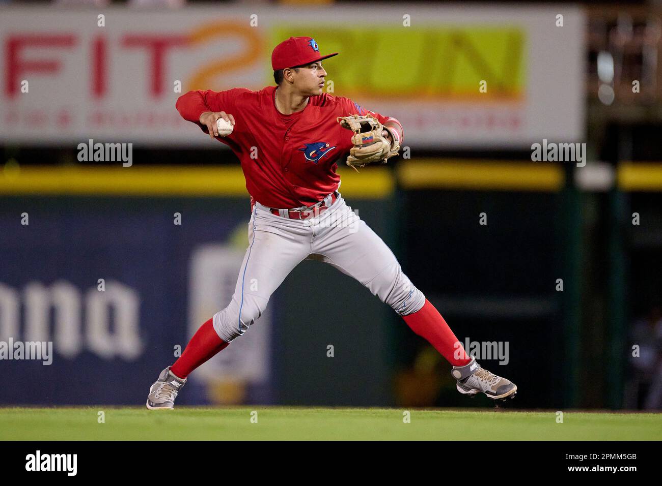 Clearwater Threshers shortstop Bryan Rincon (5) throws to first base ...