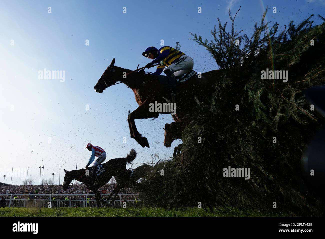 Derek Fox on Corach Rambler, top, clears the Chair fence to win the ...