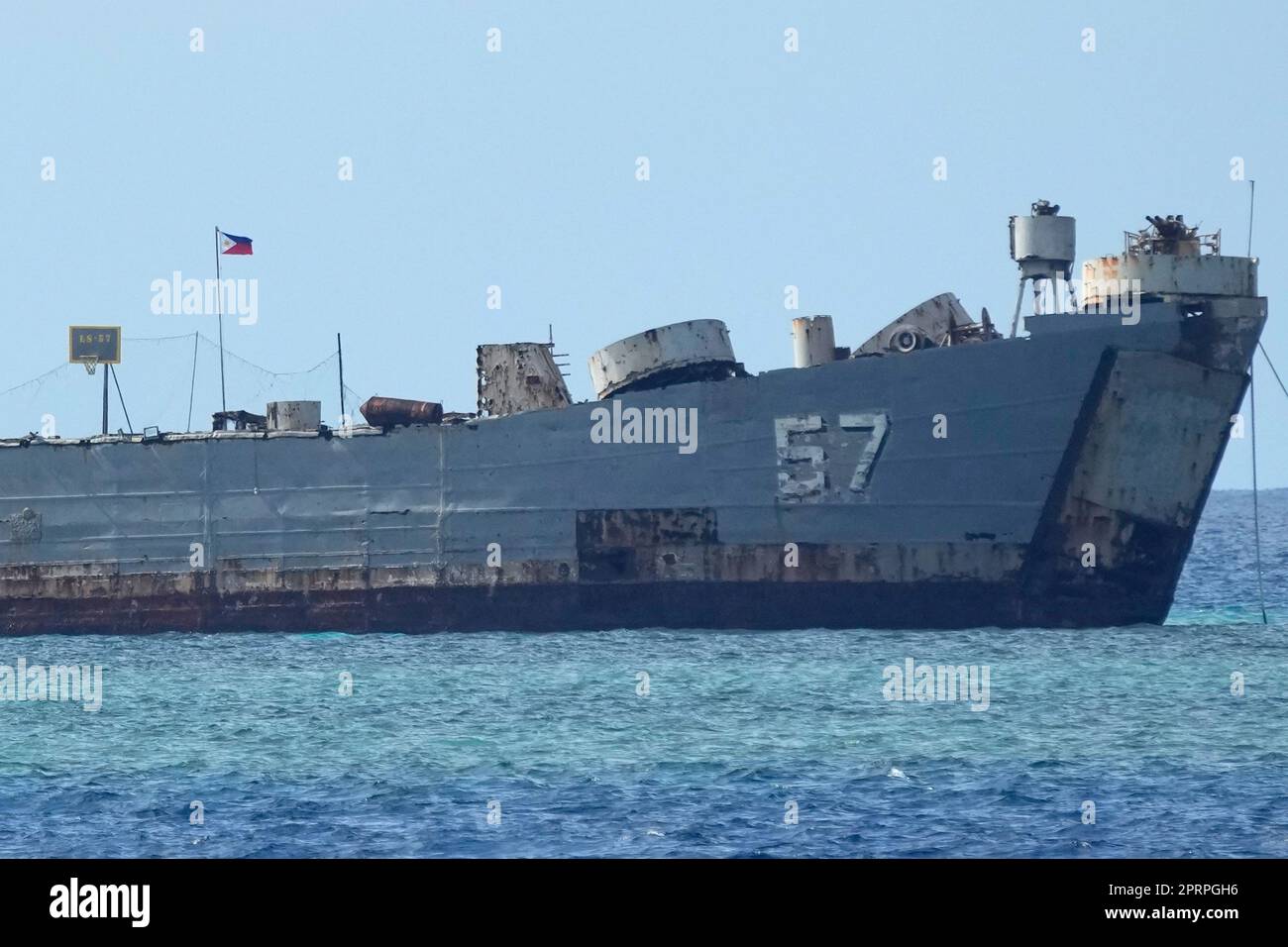 A Philippine flag and a basketball court is seen on the now crumbling ...