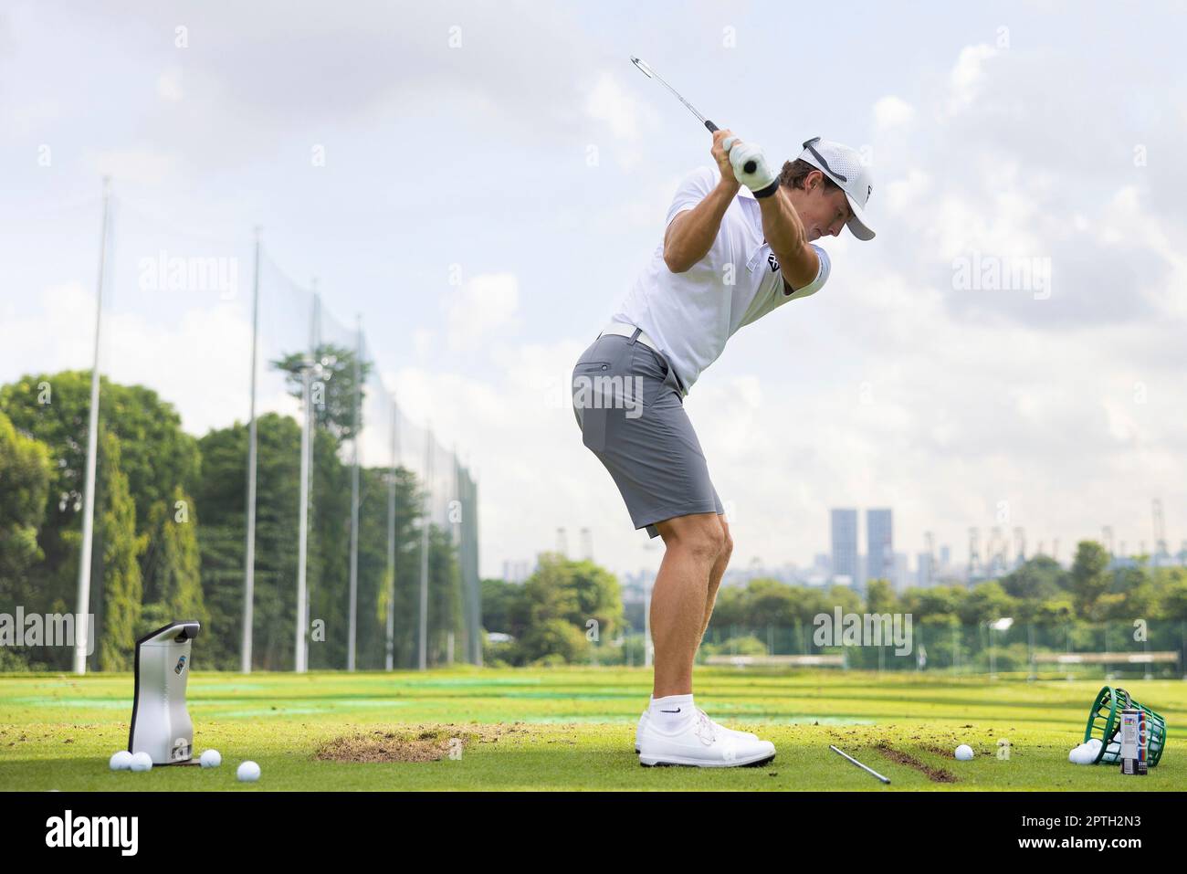 James Piot of HyFlyers GC hits his shot on the driving range during the ...