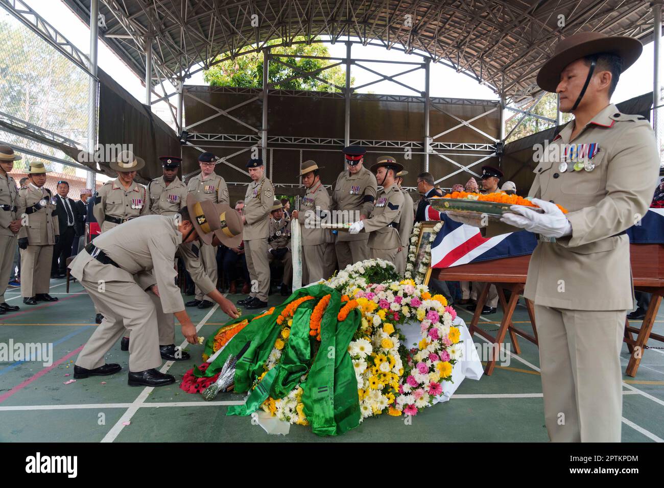 Gurkha soldiers pay their respects in front of the coffin of Rambahadur ...