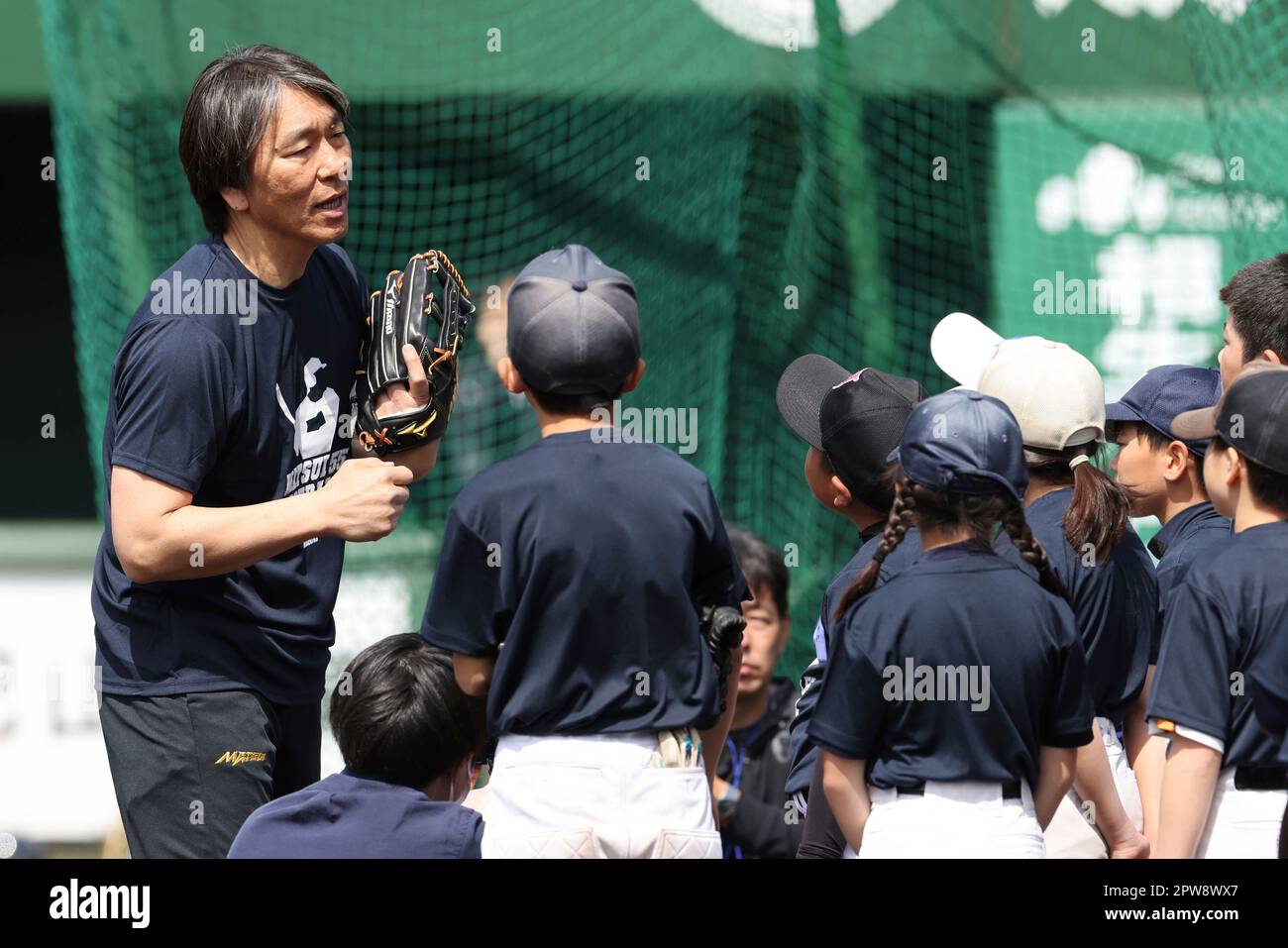 Former professional baseball player Hideki Matsui teaches children in Kawasaki City, Kanagawa ...