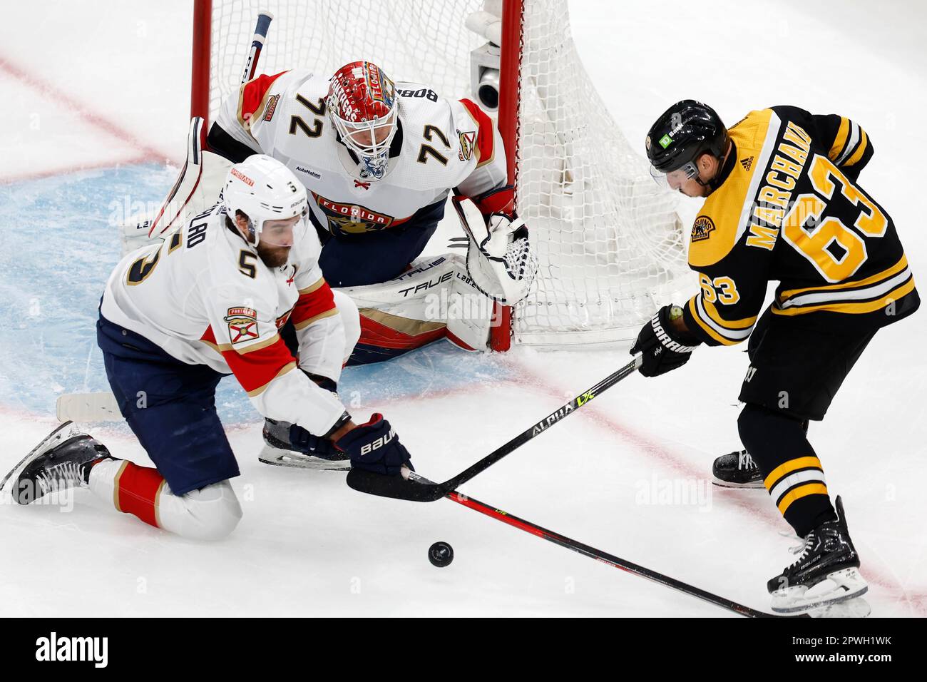Boston Bruins' Brad Marchand (63) tries to get a shot off against ...