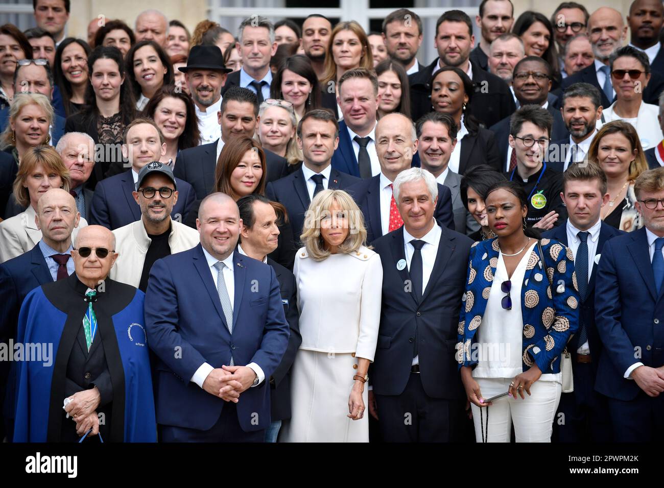 France's President Emmanuel Macron (2ndROW-C) and his wife Brigitte ...