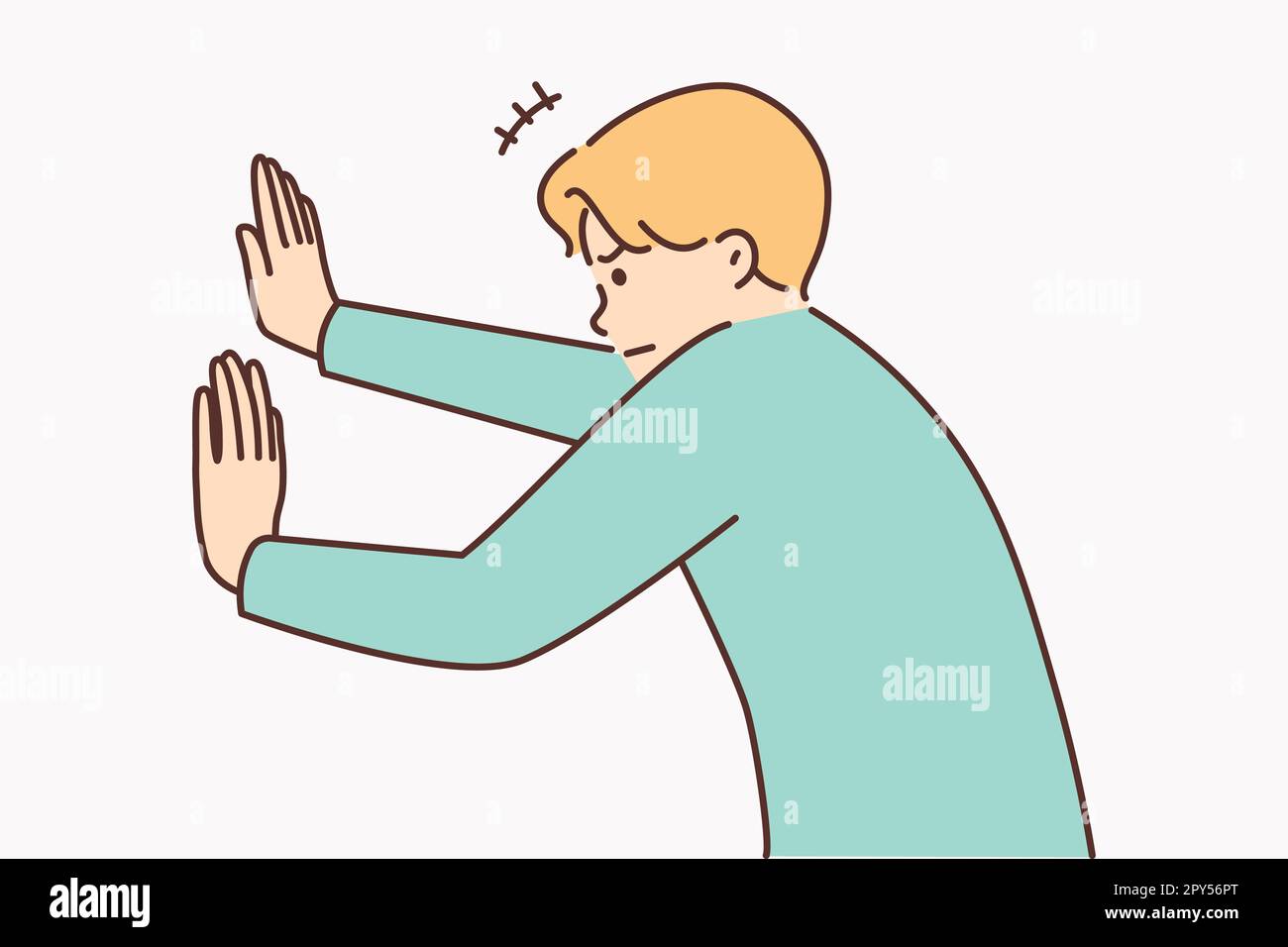 L'homme pousse tensément le mur invisible avec les mains ou se fixe le ...