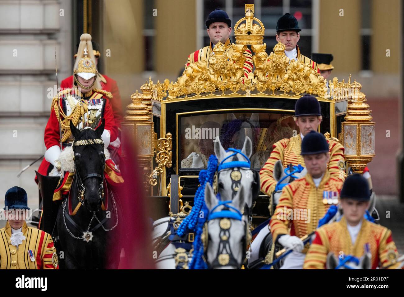 Britain's King Charles III, centre left, and Camilla, the Queen Consort, leave Buckingham Palace ...