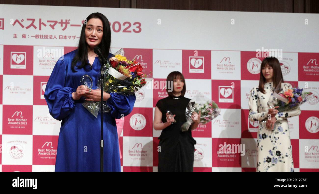 Japanese actress Yukie Nakama (L) attends a ceremony of Japan Mother Awards in Tokyo on May 11 ...