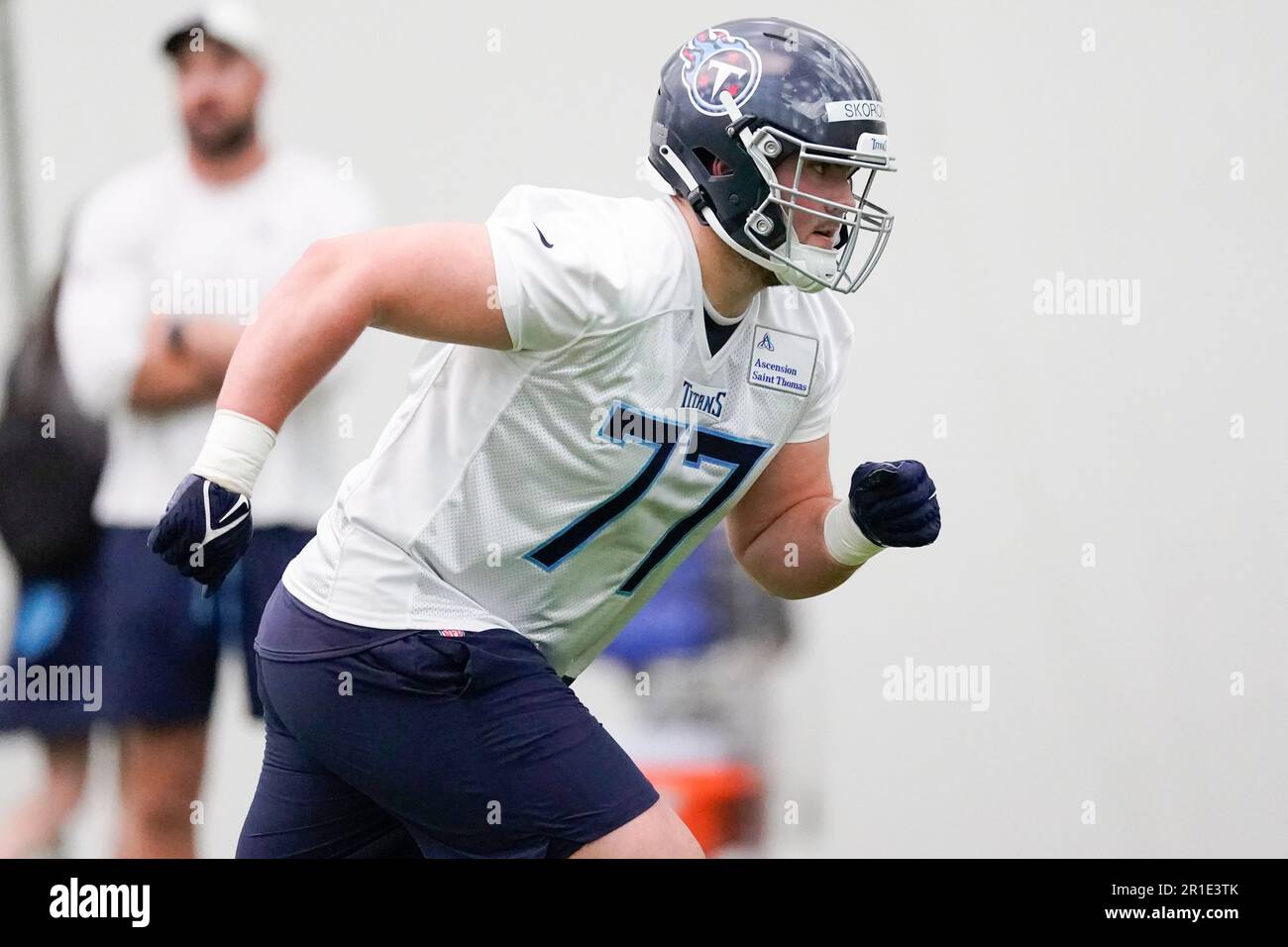 Tennessee Titans offensive lineman Peter Skoronski (77) runs through ...