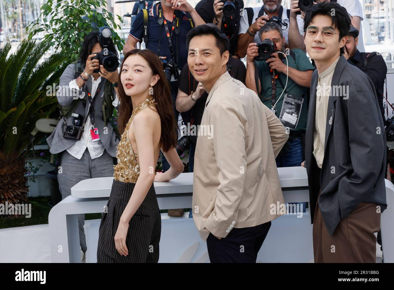 Dongyu Zhou, from left, director Anthony Chen, and Haoran Liu pose for photographers at the ...