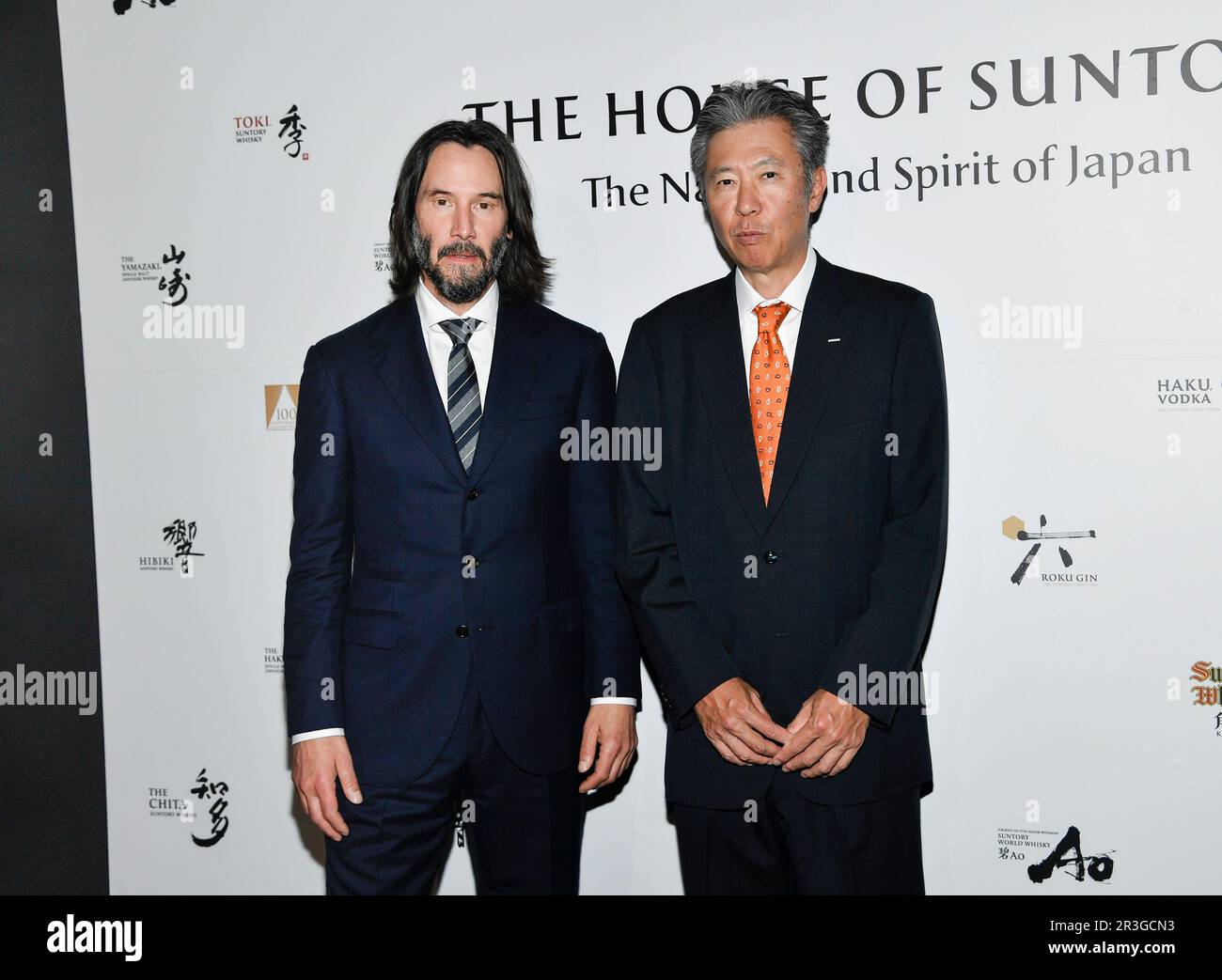 Keanu Reeves, left, and Suntory Spirits executive vice president and ...