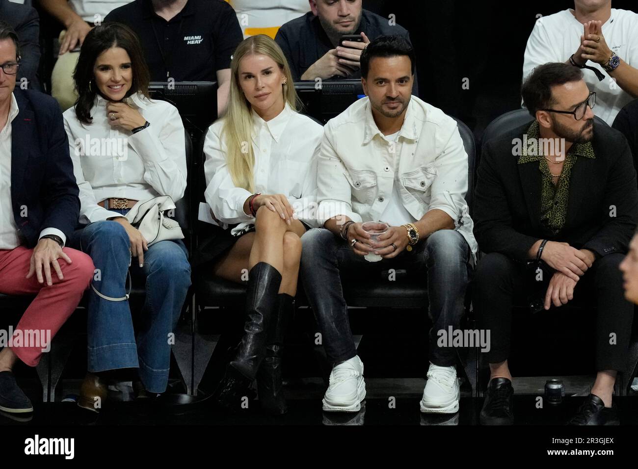 Singer Luis Fonsi, second from right, and actor Jeremy Piven watch Game ...