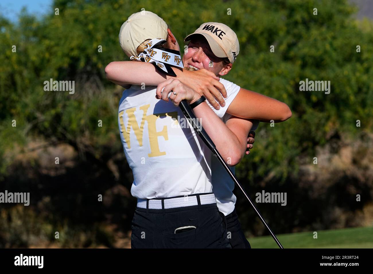 Wake Forest golfer Emilia Migliaccio, right, hugs coach Kim Lewellen ...