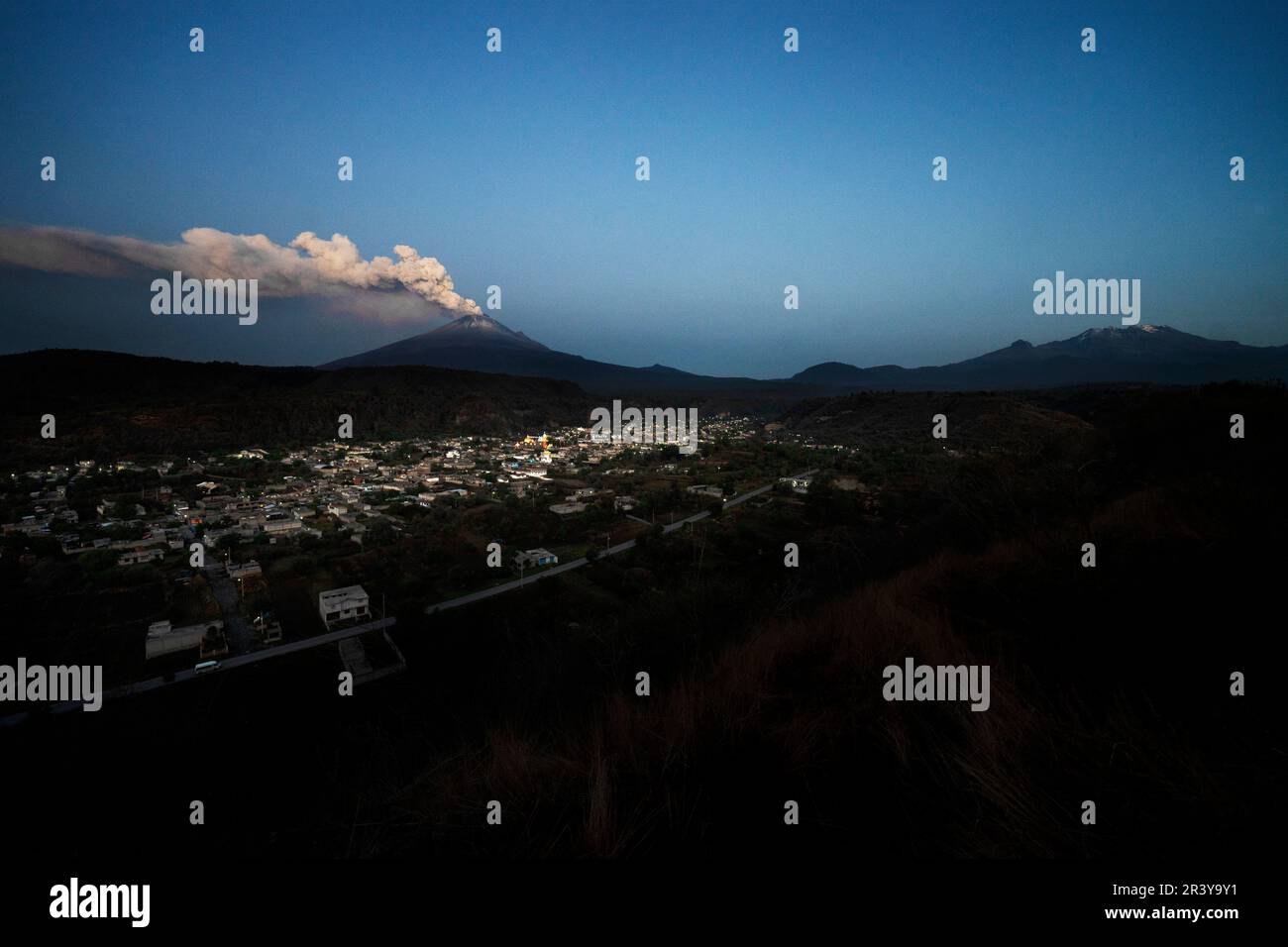 The Popocatepetl volcano spews ash and steam during an eruption seen ...
