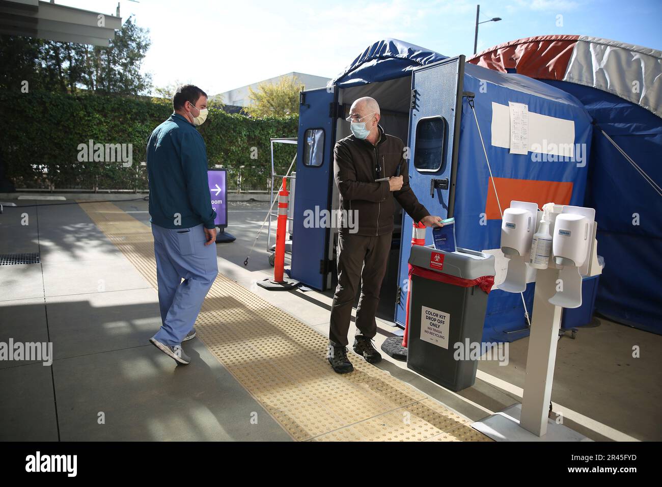 Andrew Spinetti (left), patient care technician, assists Dr. George ...